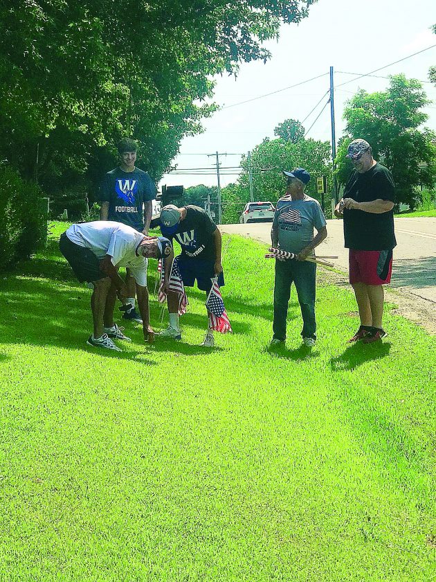 Veteran, family place flags for Veto community | News, Sports, Jobs ...